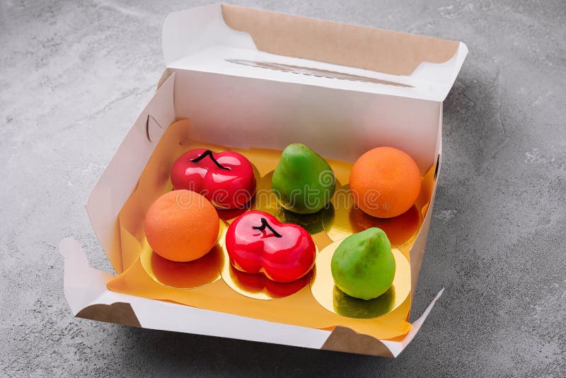 Fruit-shaped Mousse Cakes in a Box Stock Photo - Image of focus, orange ...