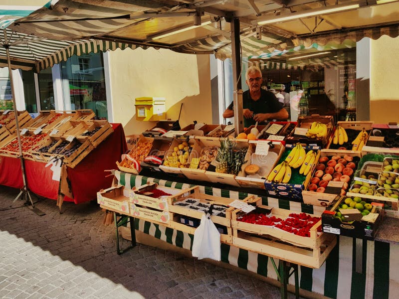 Fruit stalls at a market editorial stock photo. Image of stalls - 232076308
