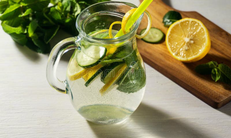 Fruit Water with Lemon, Cucumber and Mint in Glass Pitcher Stock Image ...