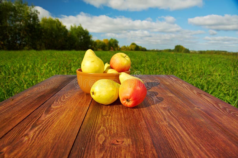 Fruit on a wooden table stock image. Image of outside - 33862019