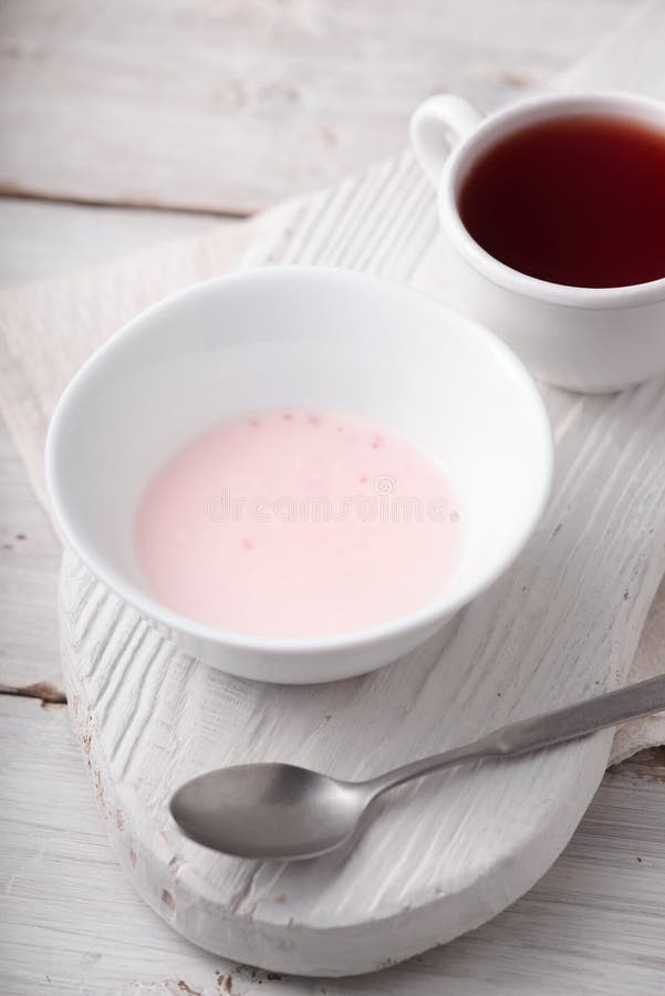 Fruit Yogurt and Cup of Tea on the White Wooden Table Stock Photo ...