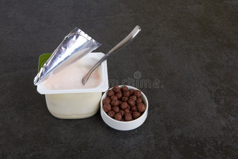 Fruit yogurt on stone stock image. Image of plastic - 243801683