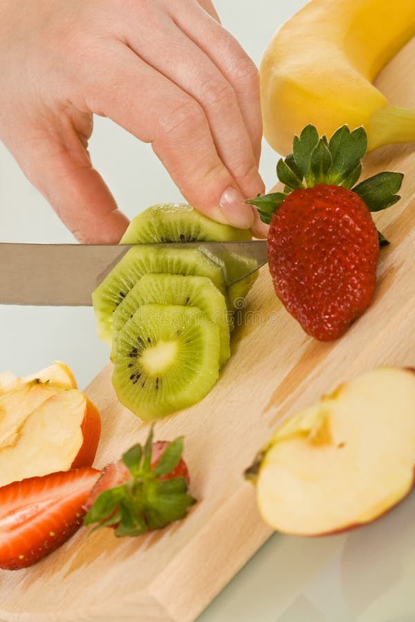 Fruits on chopping board stock photo. Image of ingredient - 9110414