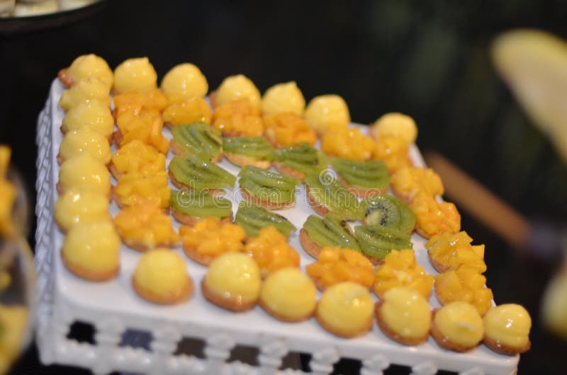 Fruits Cut into Small Pieces. Kiwi and Mango on a Wooden Box Stock ...