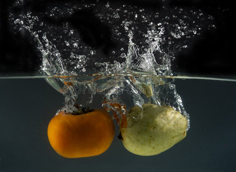 Fruits Going into Water with Splash All Around - Fresh Eating Concept ...