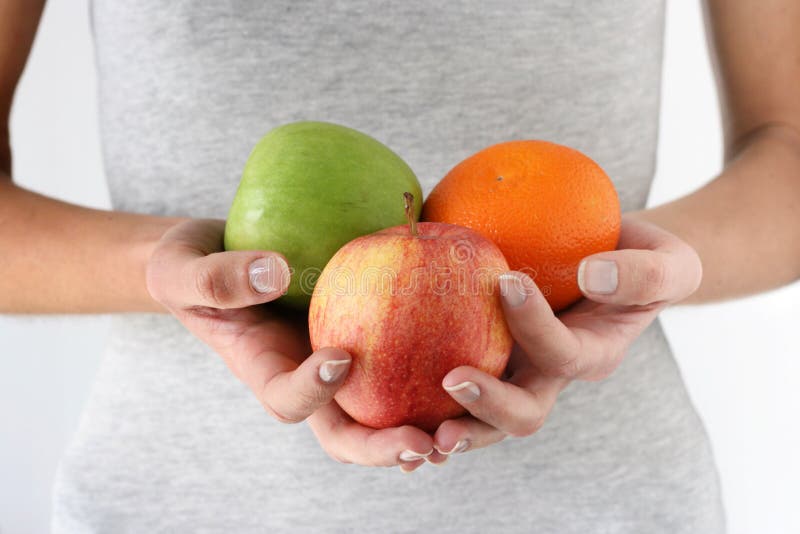 Fruits in hands stock image. Image of orange, female - 18910931