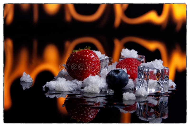 Fruits in Ice Cubes Over White at Fire in Backgraund and Snow Stock ...