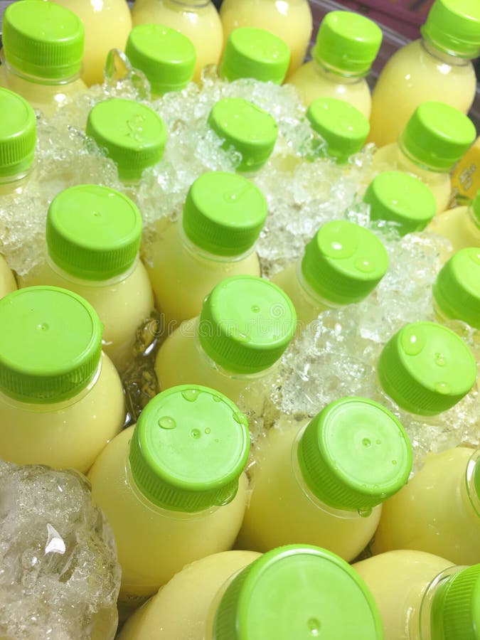 Fruits Juice and Herbal Drink in the Bottle on Ice Stock Photo - Image ...