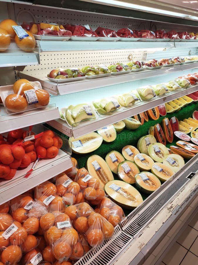 Fruits Packed Inside Plastic Container and Plastic Wrap. Editorial ...