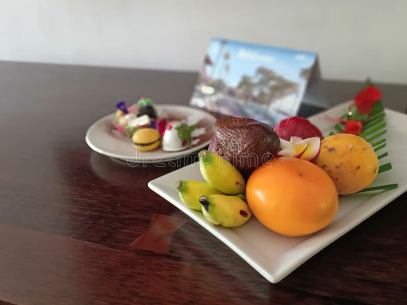 Fruits and Snacks are Placed on Plates in the Room Stock Photo - Image ...