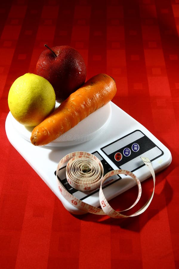 Fruits and Vegetable on a Weighing Scale with a Measuring Tape Stock ...