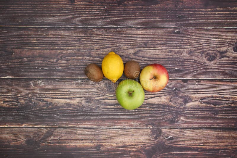 5 fruits on wooden table stock image. Image of food - 143424675