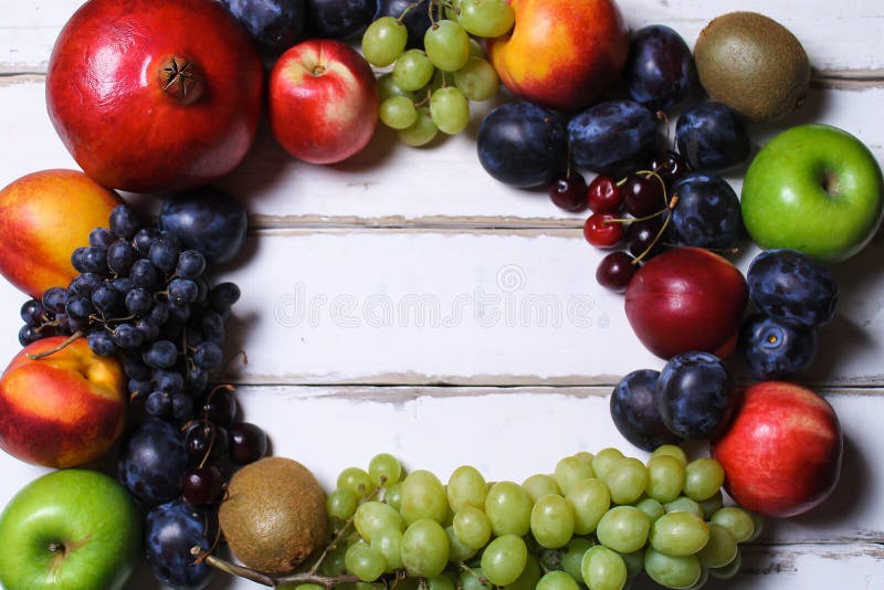 Fruits on a wooden table stock photo. Image of berries - 101495864