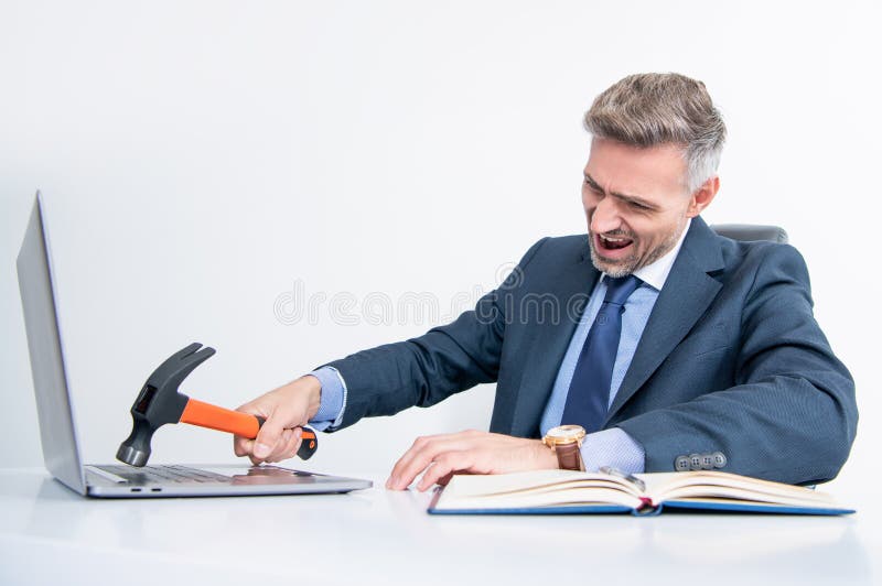 Frustrated Boss Hitting Computer with Hammer in Office Stock Photo ...