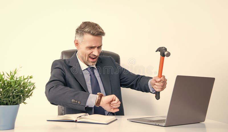 Frustrated Boss Hitting Laptop with Hammer and Checking Time Stock ...