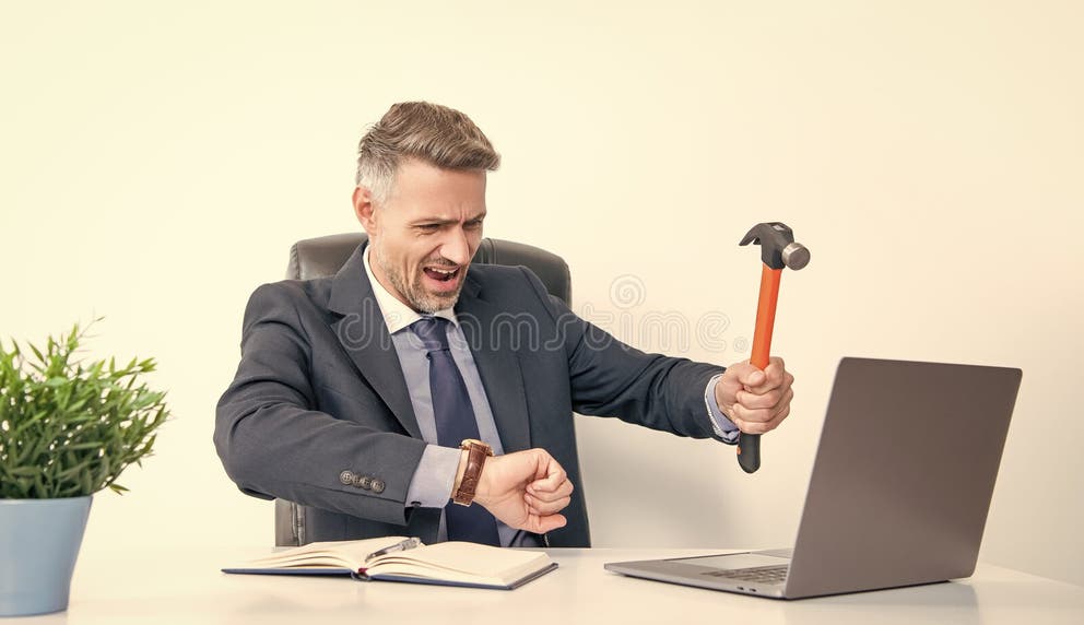 Frustrated Boss Hitting Laptop with Hammer and Checking Time Stock ...