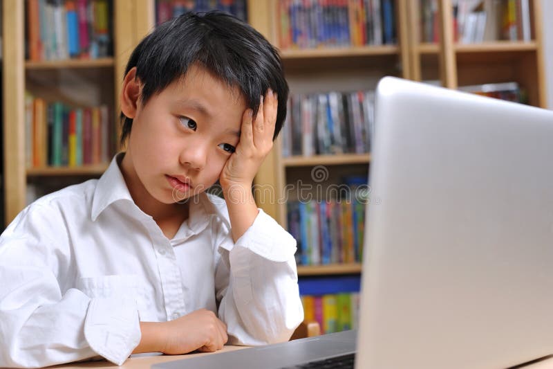 Frustrated Boy in White Shirt in Front of Laptop Computer Stock Image ...