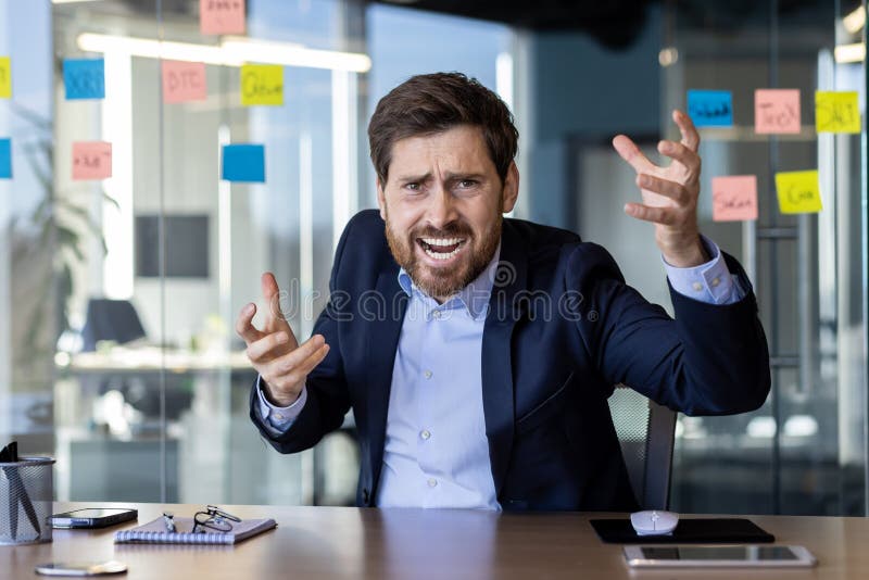 Angry Businessman Arguing during a Tense Office Meeting Stock Photo ...