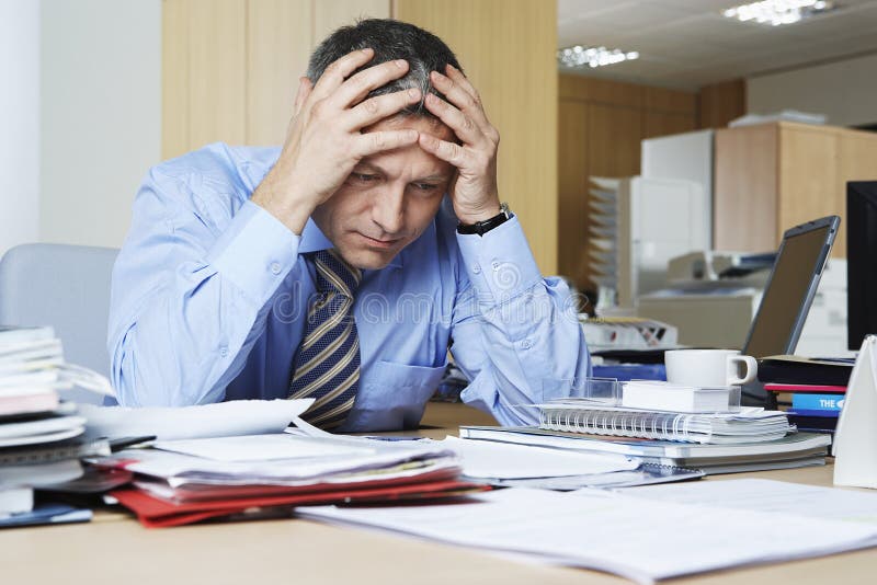 Frustrated Businessman at Office Desk Stock Image - Image of migraine ...