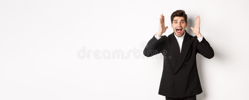 Frustrated and Concerned Man in Black Suit, Screaming in Panic and ...