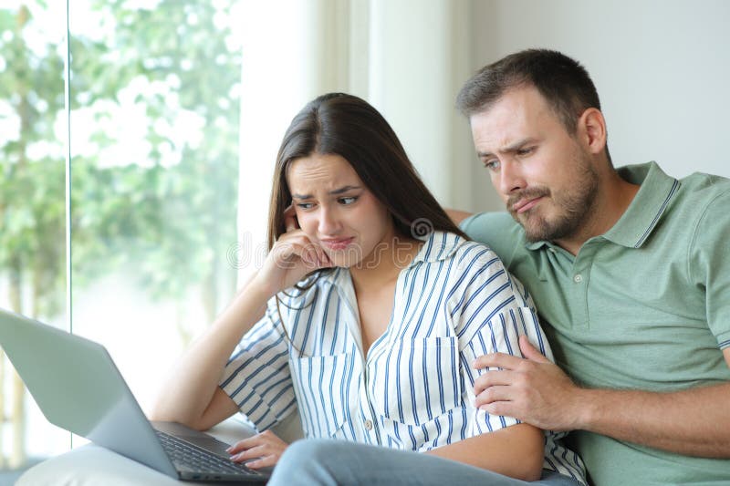 Frustrated Couple Checking Computer Content at Home Stock Image - Image ...