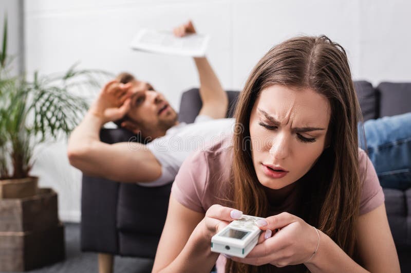 Frustrated Couple with Remote Controller and Stock Image - Image of ...