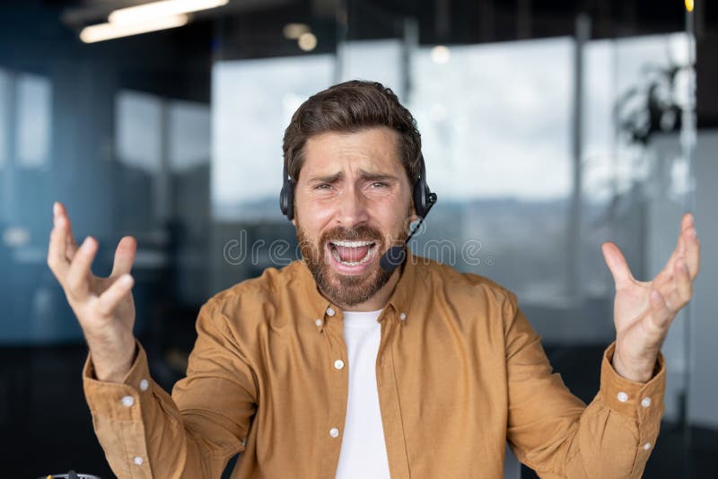 Frustrated Customer Support Agent Using Headset in Modern Office ...