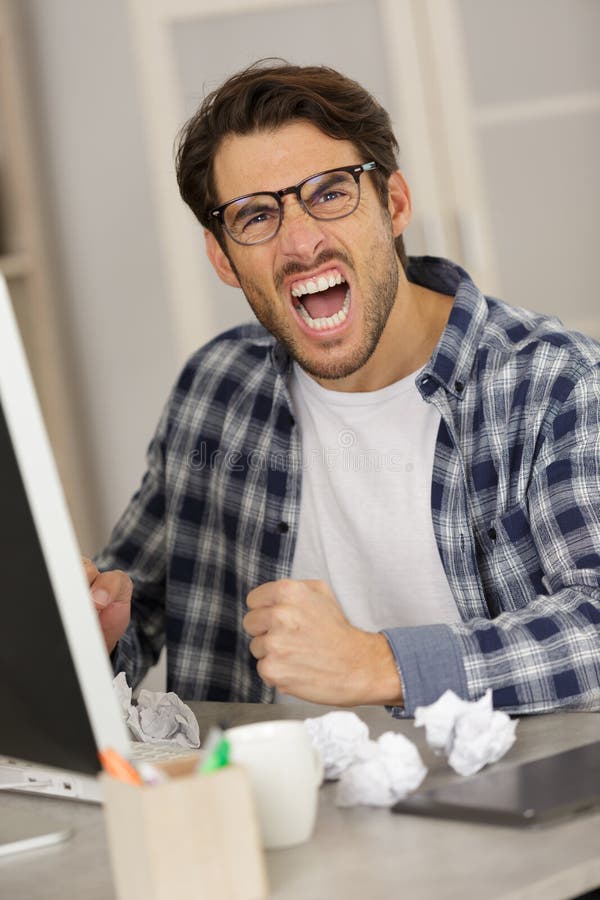 Frustrated Employee with Balled Papers on Desk Stock Photo - Image of ...