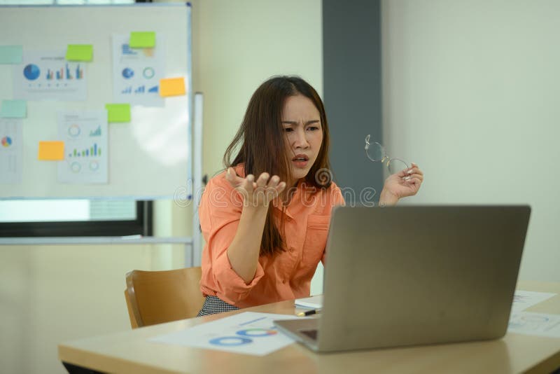 Frustrated Female Office Worker Sitting at Her Desk, Staring at Her ...