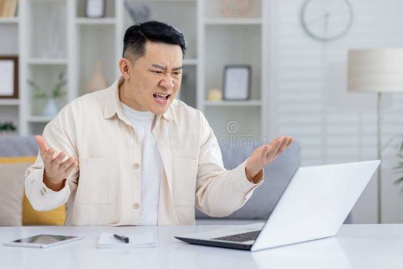Frustrated Man Expressing Anger at Computer Screen in Home Office Stock ...