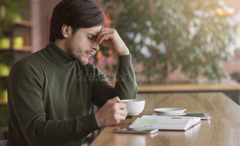 Frustrated Man Having Problems with Job, Drinking Tea at Cafe Stock ...