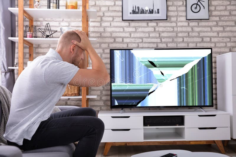 Frustrated Man Looking at Broken TV Stock Photo - Image of ...