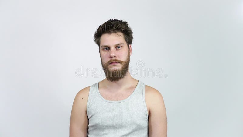 Frustrated Man Looking at the Camera.a Young Guy with a Beard in ...