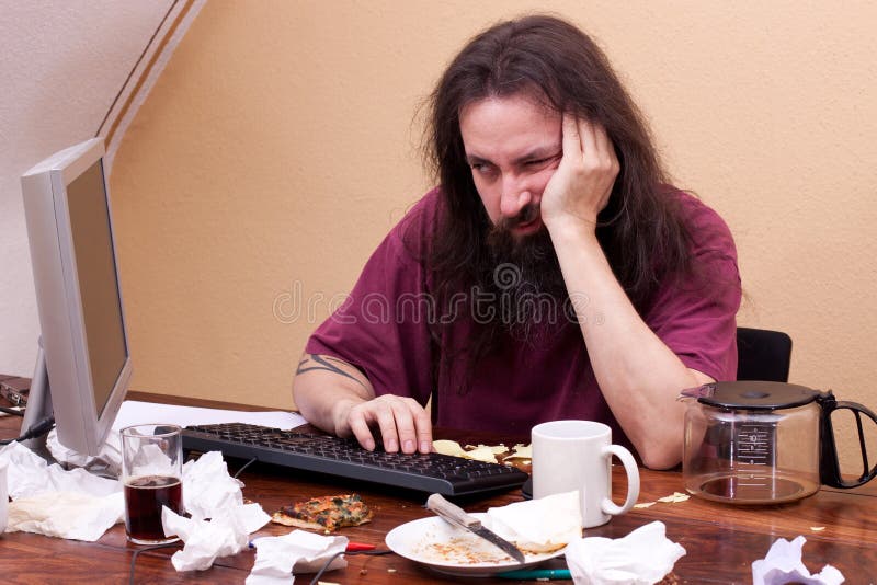 Frustrated Man Sitting on the Computer and is Thinking Stock Image ...