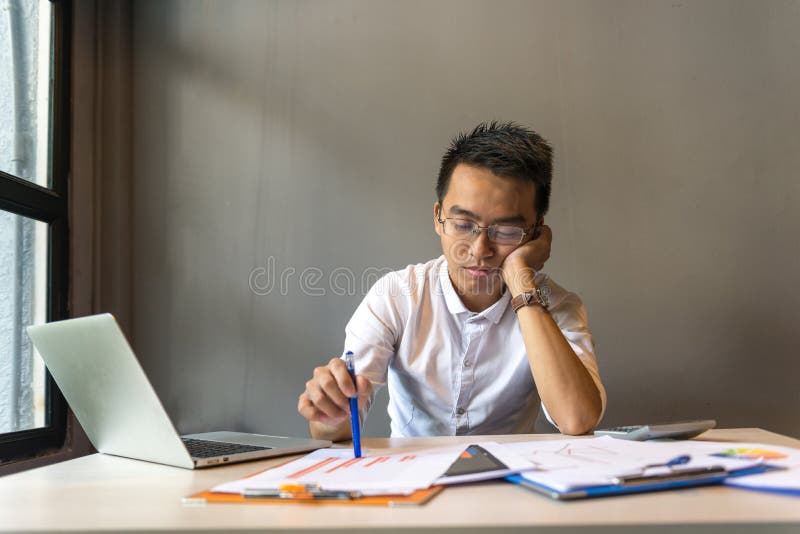 Frustrated Man Sitting at Working Desk with Laptop and Document Stock ...