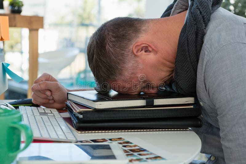Frustrated Man Sleeping on Files in Office Stock Photo - Image of focus ...
