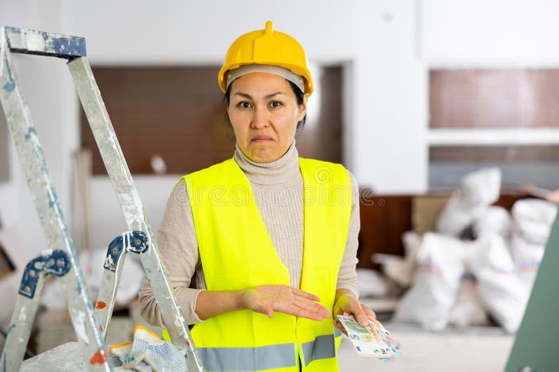 Frustrated Woman Builder is Unhappy with Earned Money Stock Photo ...