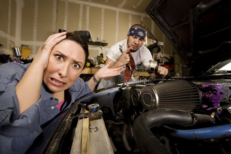 Frustrated Woman with Incompetent Mechanic in Back Stock Image - Image ...