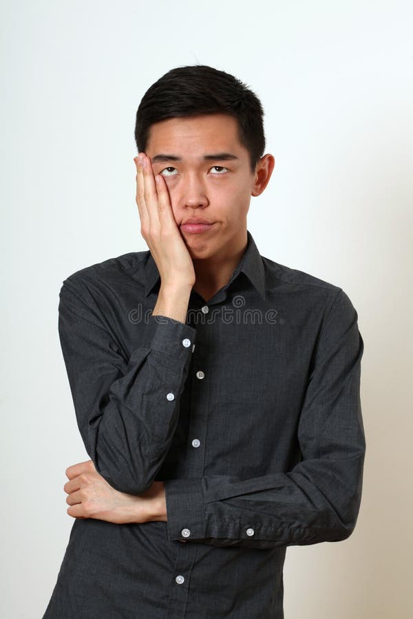 Frustrated Young Asian Man Covering His Face with a Palm Stock Image ...