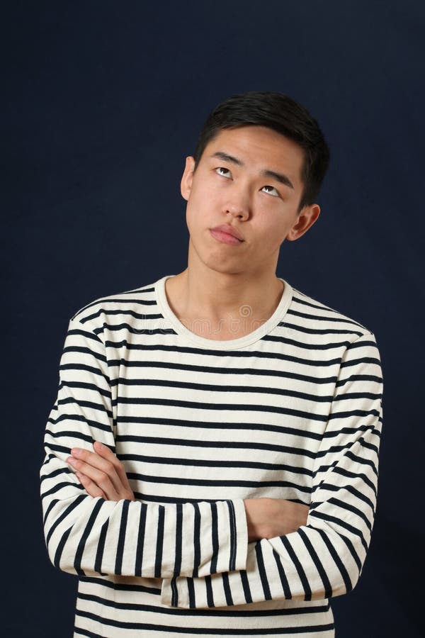 Frustrated Young Asian Man with Crossed Hands Rolling Eyes Up Stock ...