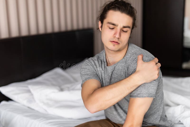 Frustrated Young Man Feels Pain in Back after Sleep Stock Photo - Image ...