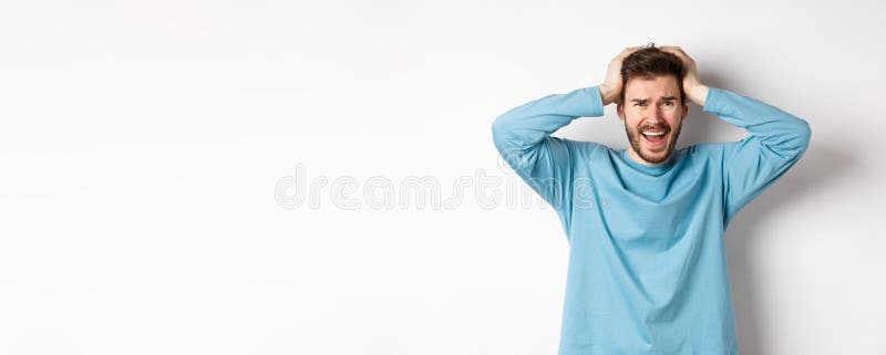 Frustrated Young Man Screaming in Panic, Standing Anxious on White ...