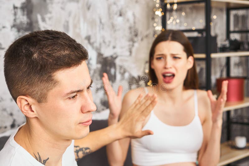 A Young Married Couple Screams Quarrels Swears In The Bedroom Stock