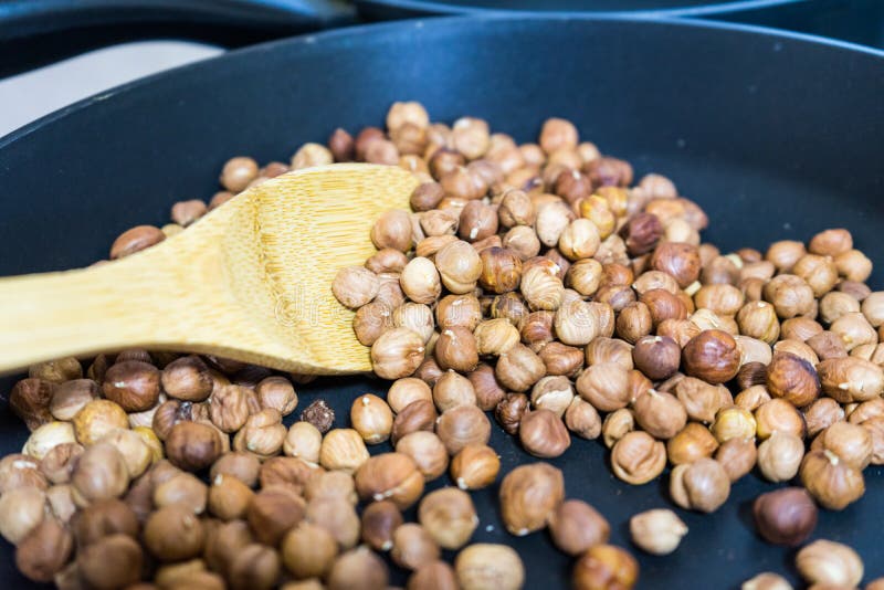 Fry Hazelnuts in a Frying Pan. Fresh Nuts in the Pan Stock Photo ...