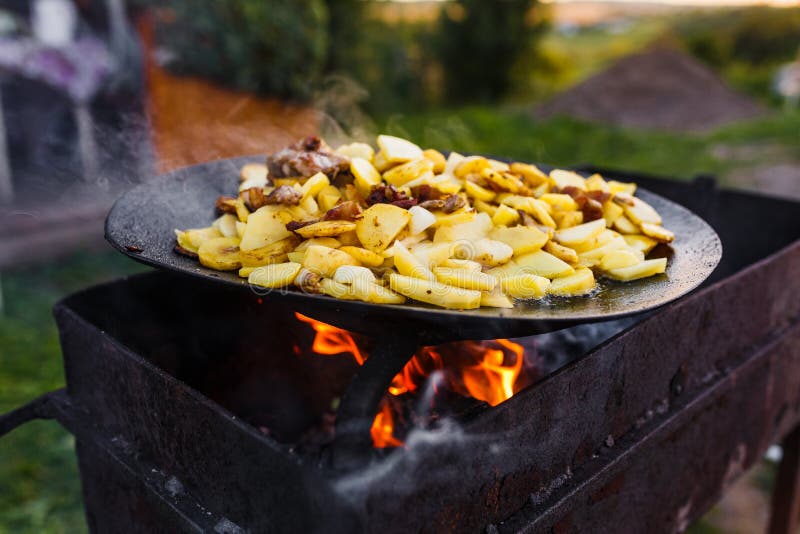 Fry Potatoes on Open Fire in the Open Air Stock Photo - Image of ...