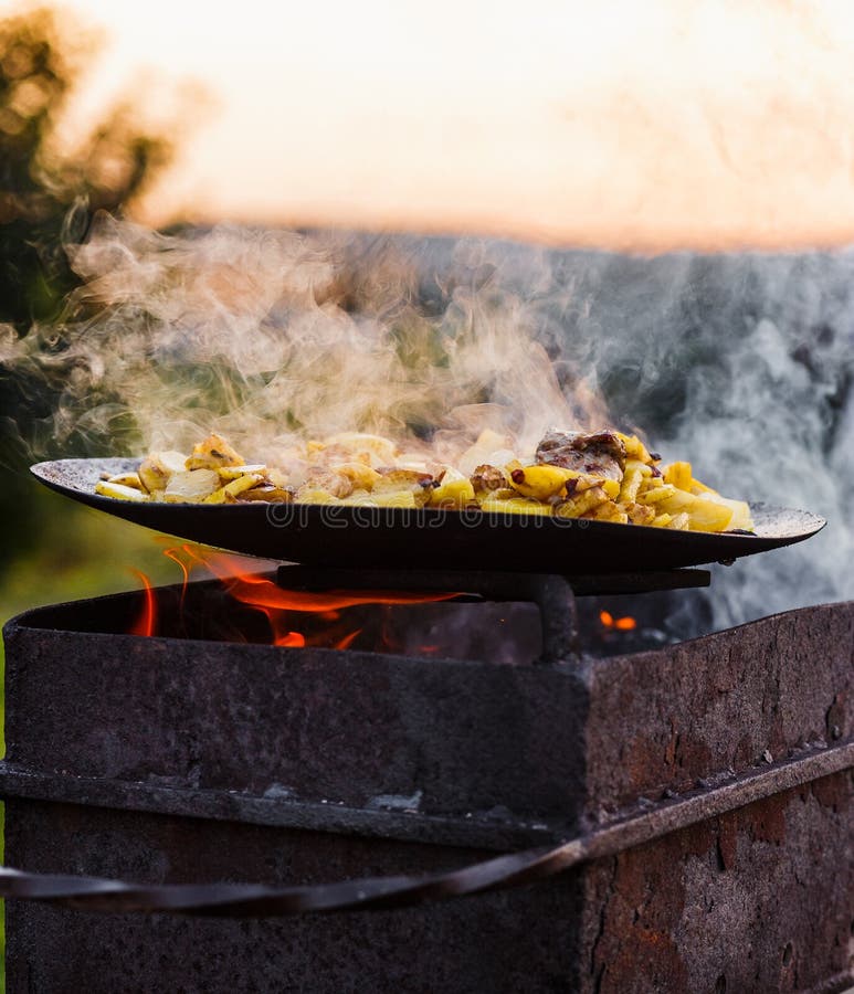 Fry Potatoes on Open Fire in the Open Air Stock Photo - Image of potato ...