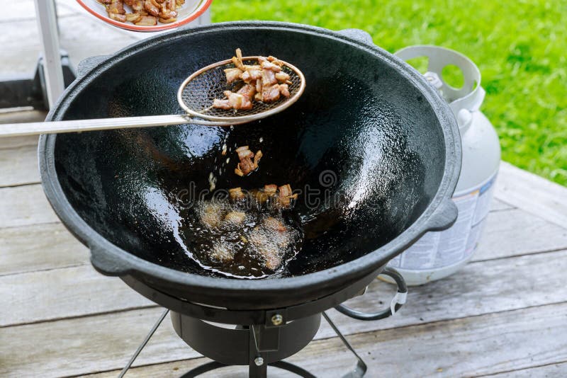 Frying Bacon in Cauldron on Fire Outside Stock Image - Image of dish ...