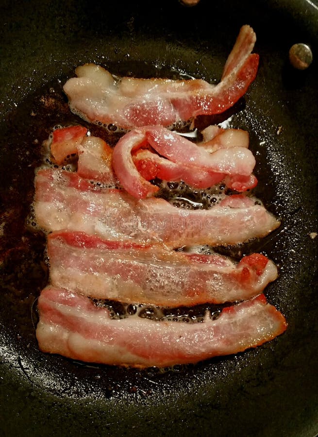 Frying bacon stock photo. Image of skillet, cooking - 102886348