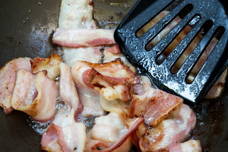 Frying bacon stock photo. Image of skillet, cooking - 102886348