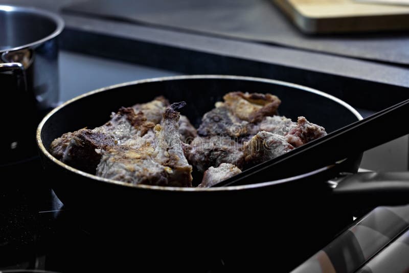 Frying beef in a pan stock image. Image of ingredient - 167065703